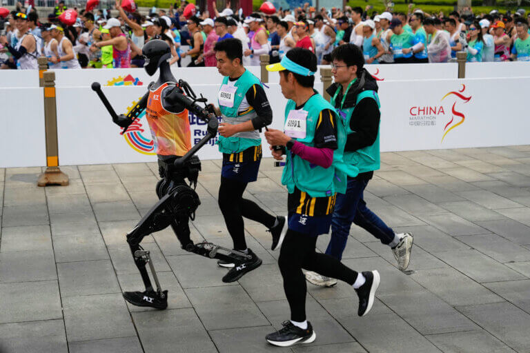 Humanoid robots run a half-marathon in China alongside humans ...